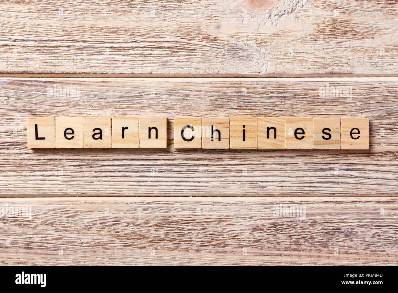 Learn chinese word written on wood block. Learn chinese text on table ...