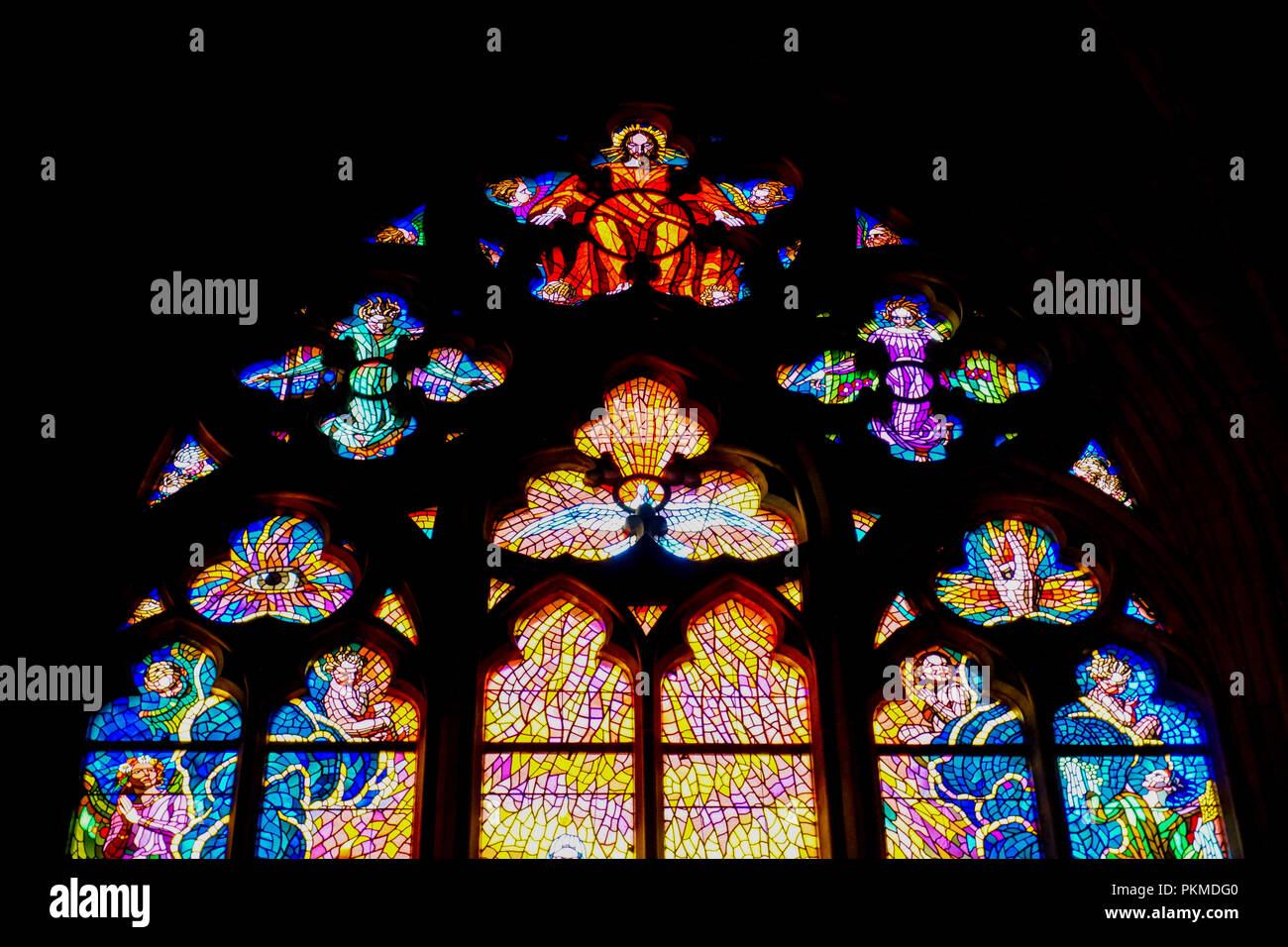 Stained glass window with cross and icons in st. Vitus Cathedral ...