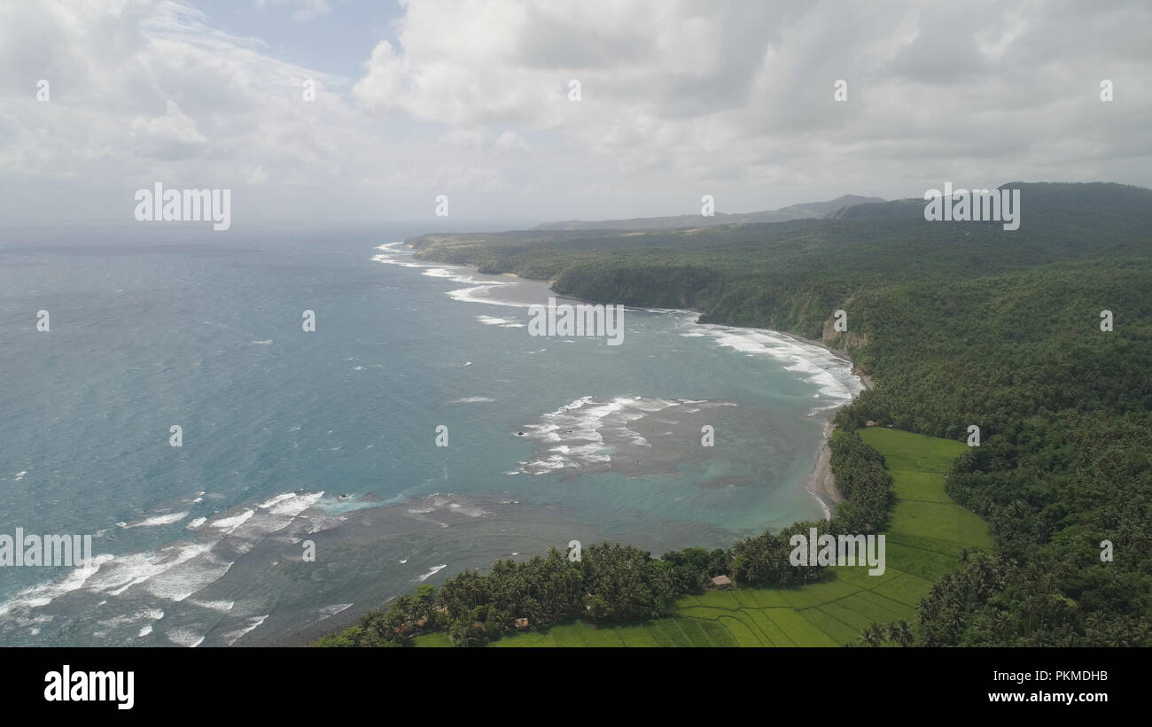 Aerial view of seashore with beach, lagoons and coral reefs. Bulusan ...