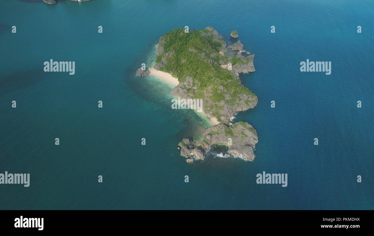Aerial view island with sand beach and turquoise water in blue lagoon ...
