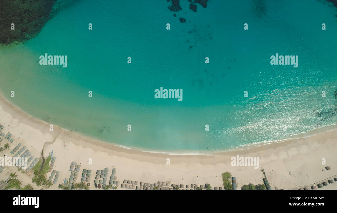 Aerial view of beautiful tropical beach with turquoise water in blue ...