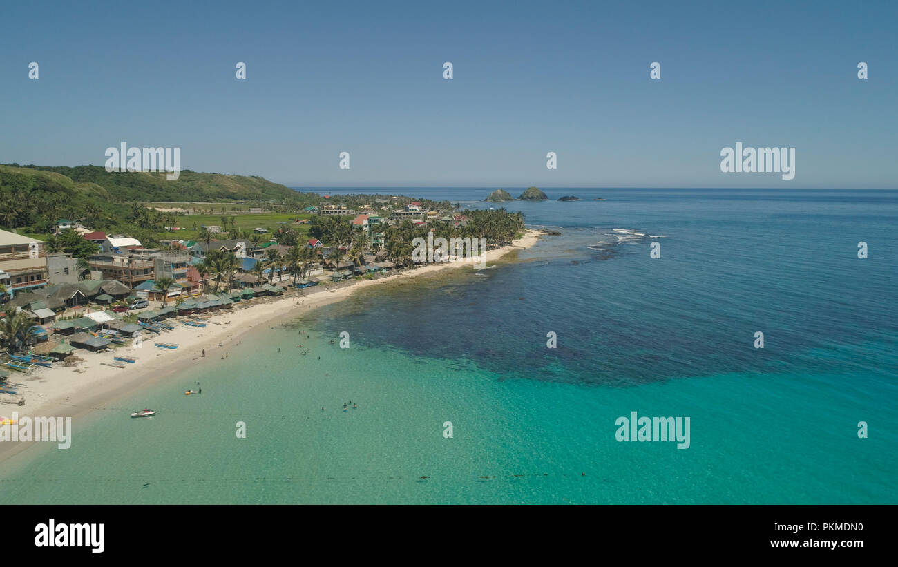 Aerial view of beautiful tropical beach with turquoise water in blue ...