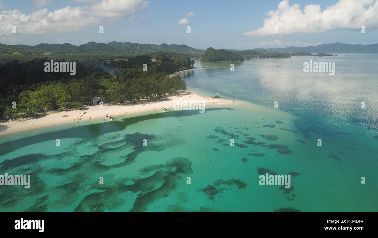 Aerial view of beautiful tropical beach with turquoise water in blue ...