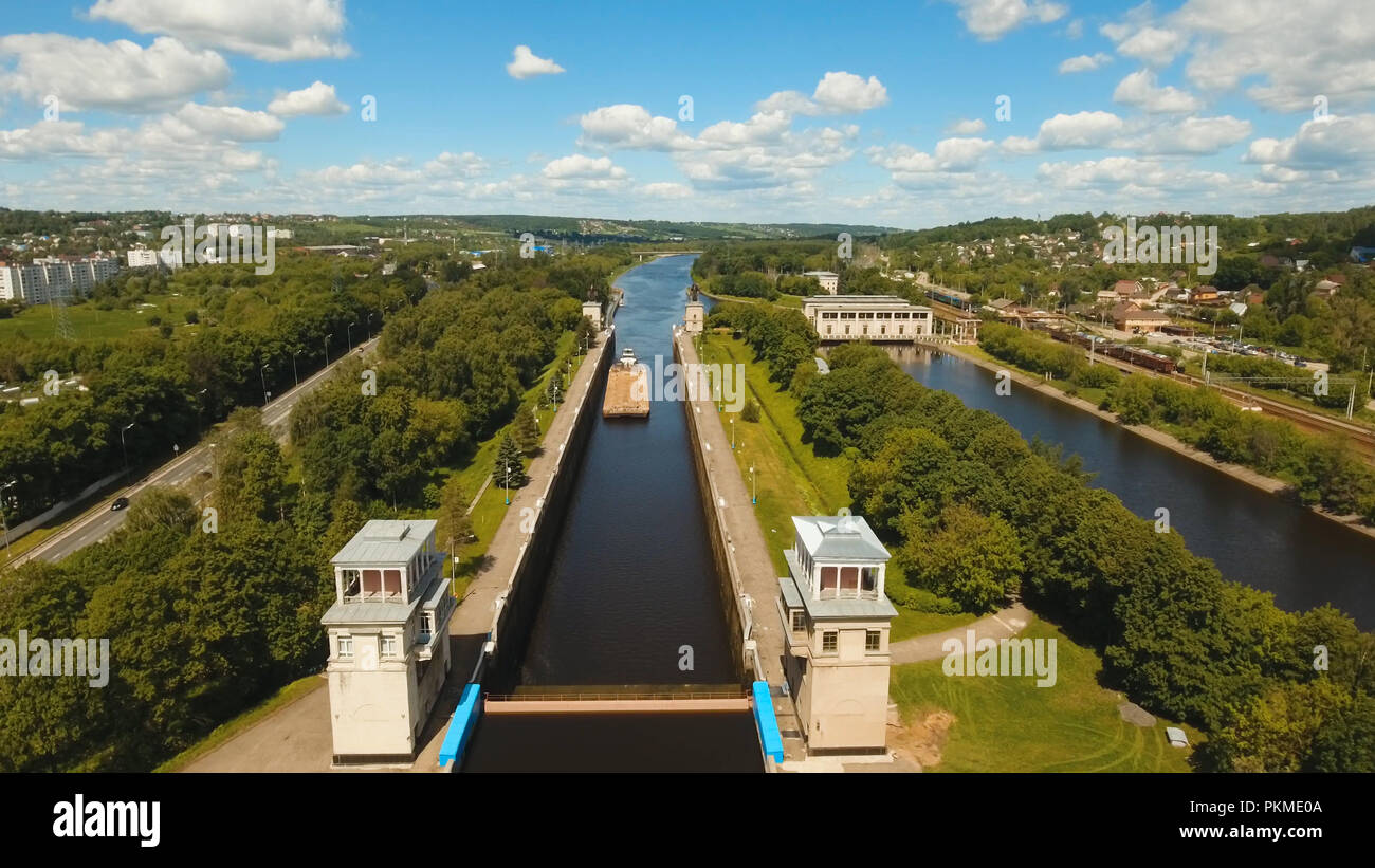 Sluice Gates on the River. Aerial view barge, ship in the river gateway ...