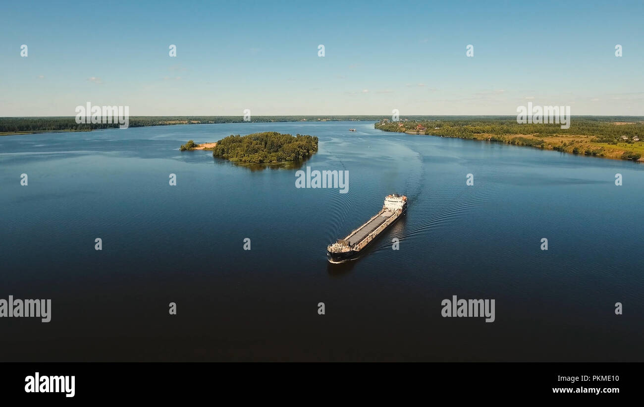 Aerial view:Barge with cargo on the river. River, cargo barge, highway ...