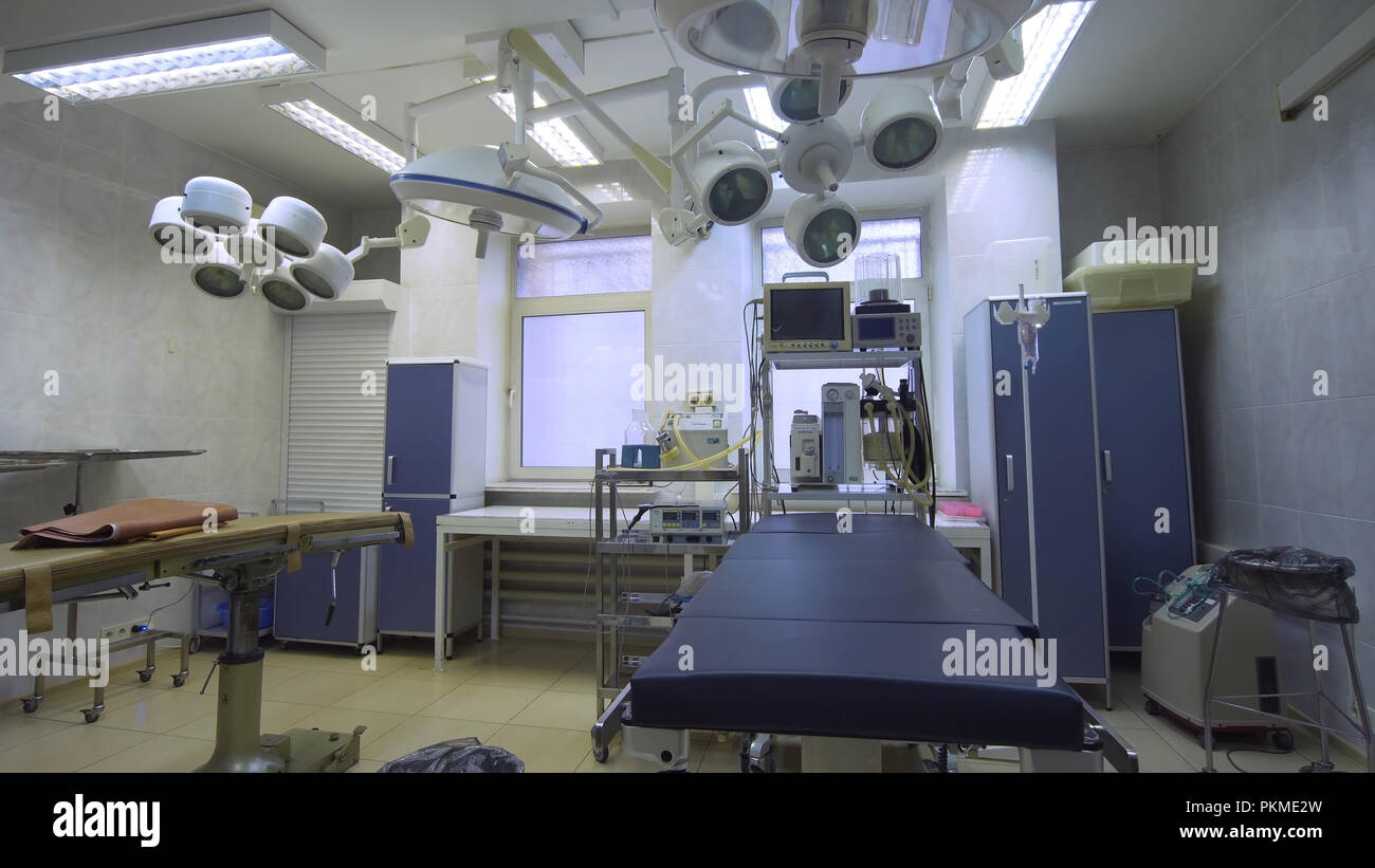 Operating room at hospital with equipment and medical devices. Table ...