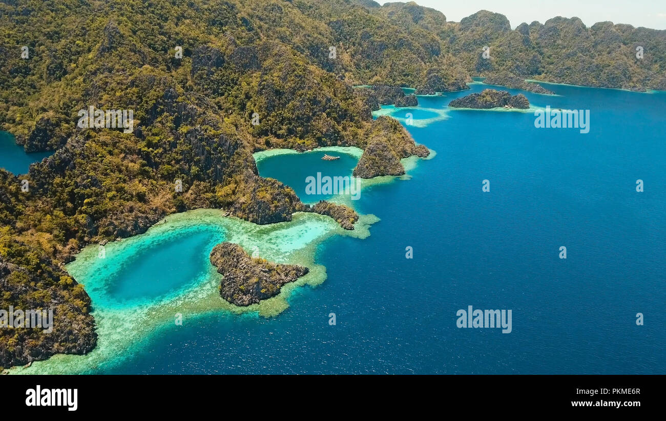 Aerial view: Lagoon with blue, azure water in the middle of small ...
