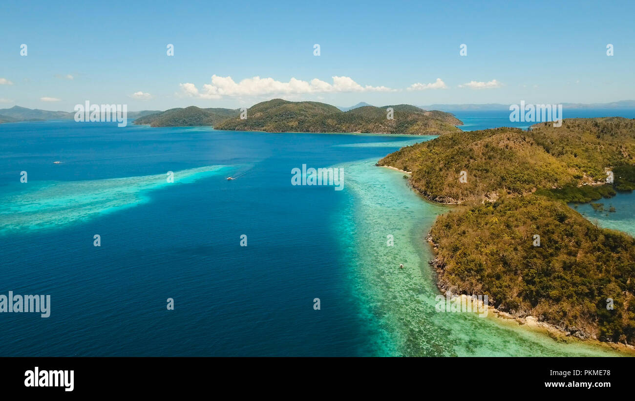 Aerial view: Lagoon with blue, azure water in the middle of small ...