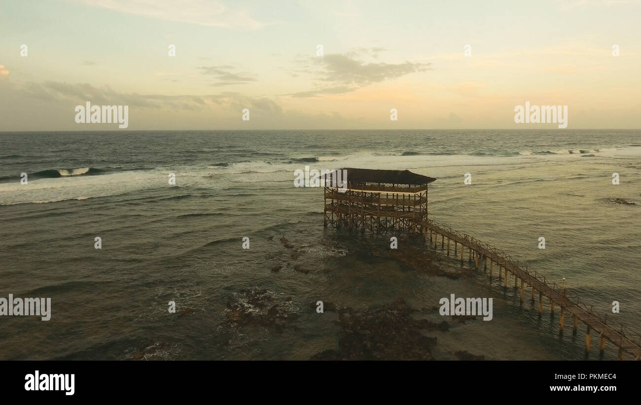 Viewpoint in the ocean at Cloud Nine surf point at sunset, Siargao ...