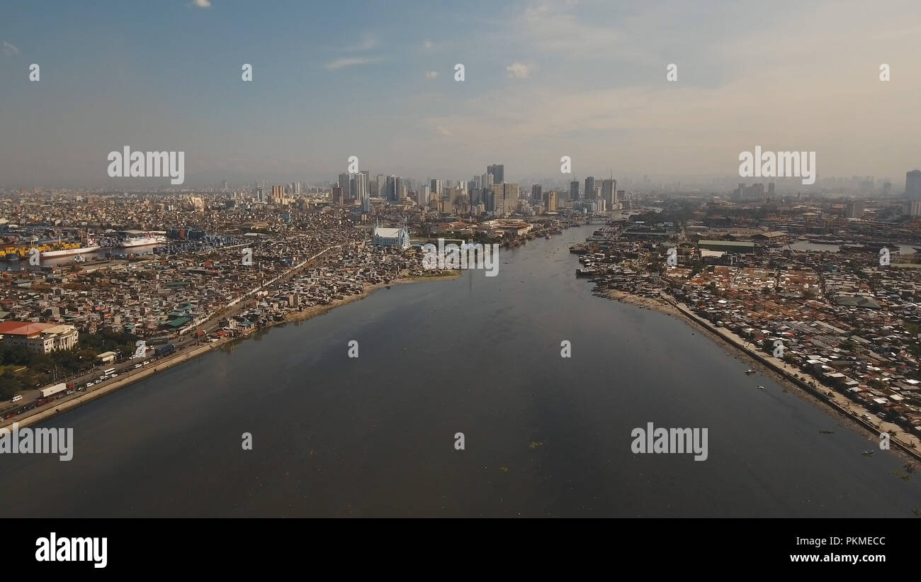 Aerial view skyline of Manila city. Fly over city with skyscrapers and ...