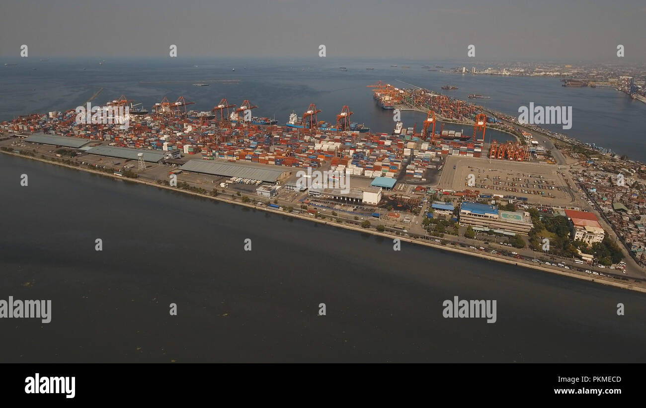 Aerial view industrial cargo port with ships and cranes, Manila. View ...