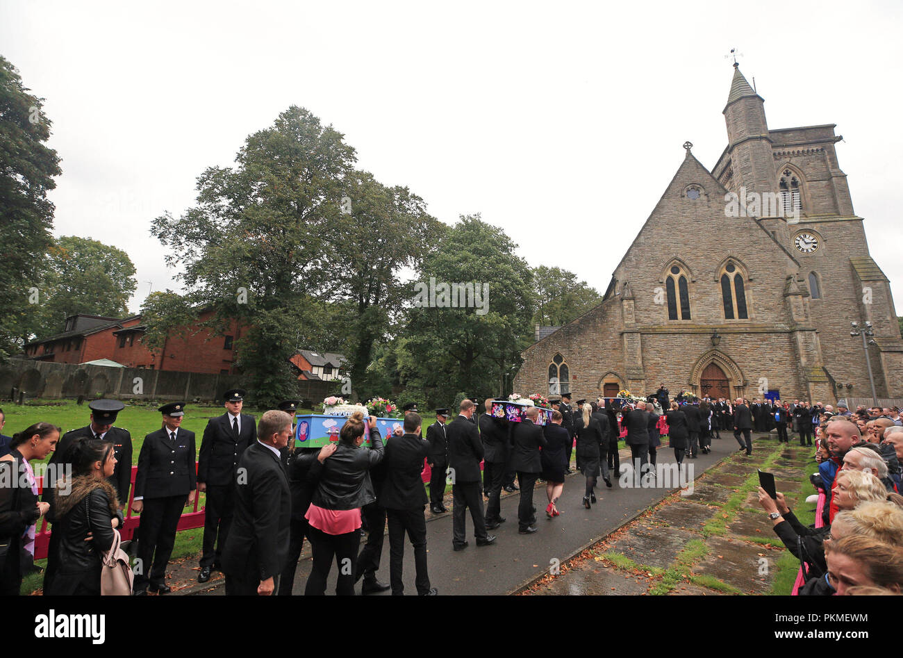 The coffins of Demi, Brandon, Lacie and Lia Pearson are carried into St ...