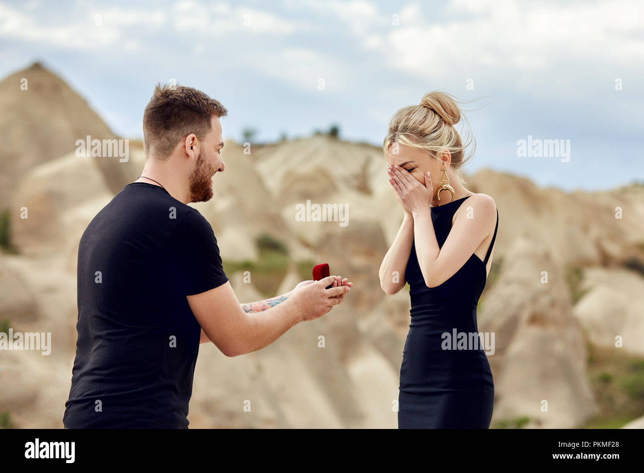 Man makes a marriage proposal to his girlfriend. Engagement of a couple ...
