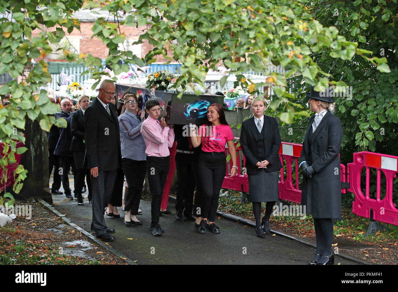 The coffins of Demi, Brandon, Lacie and Lia Pearson are carried into St ...