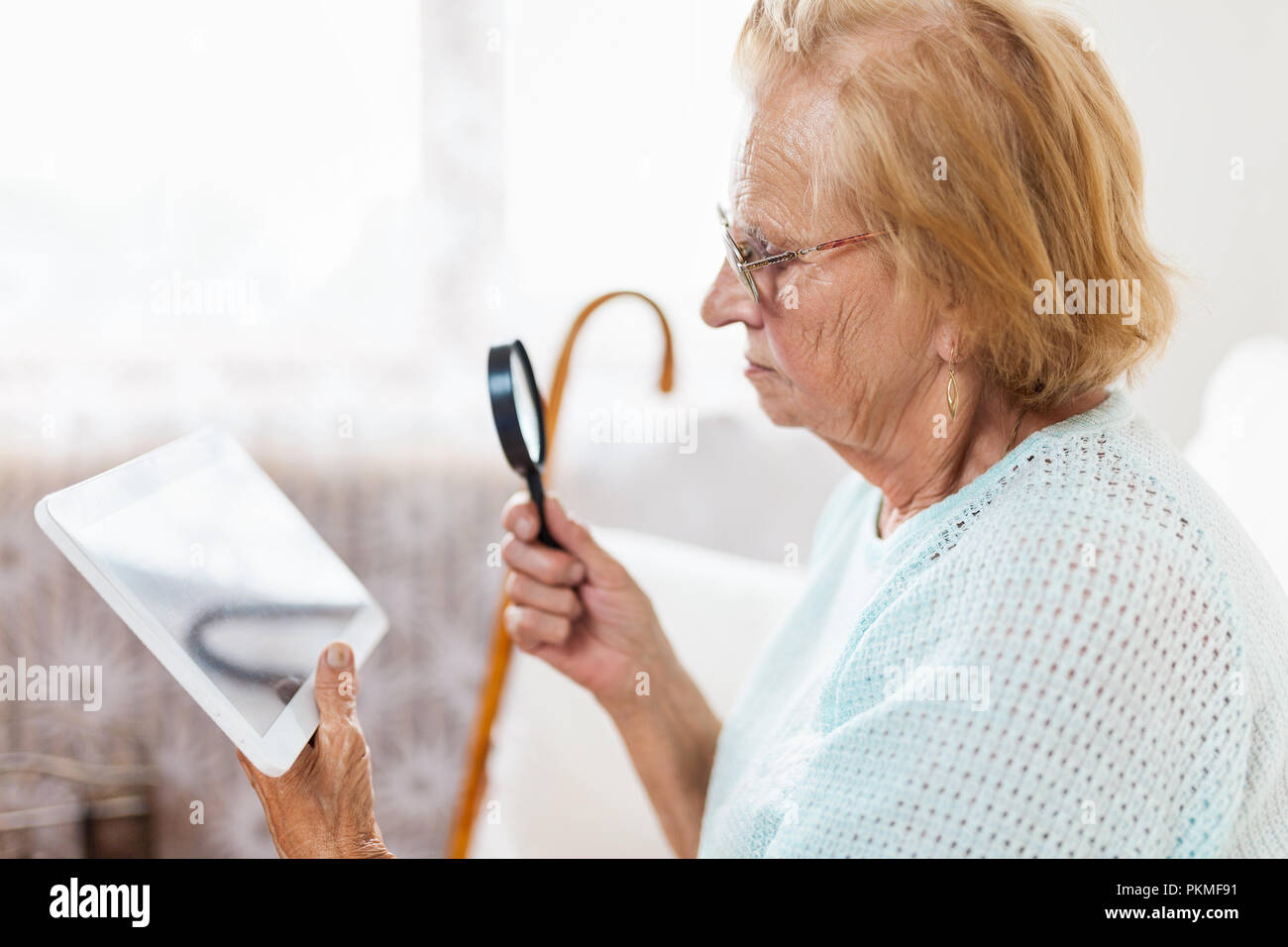Old woman reading glasses computer hi-res stock photography and images ...