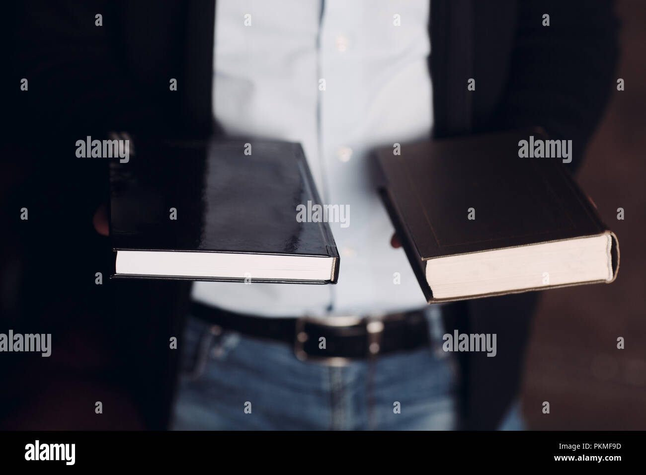 The man choice read two book Stock Photo - Alamy