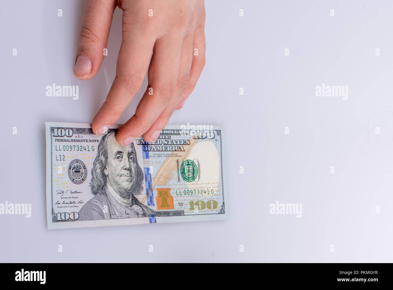 Hands holding American dollar banknotes and Turksh Lira banknotes side ...