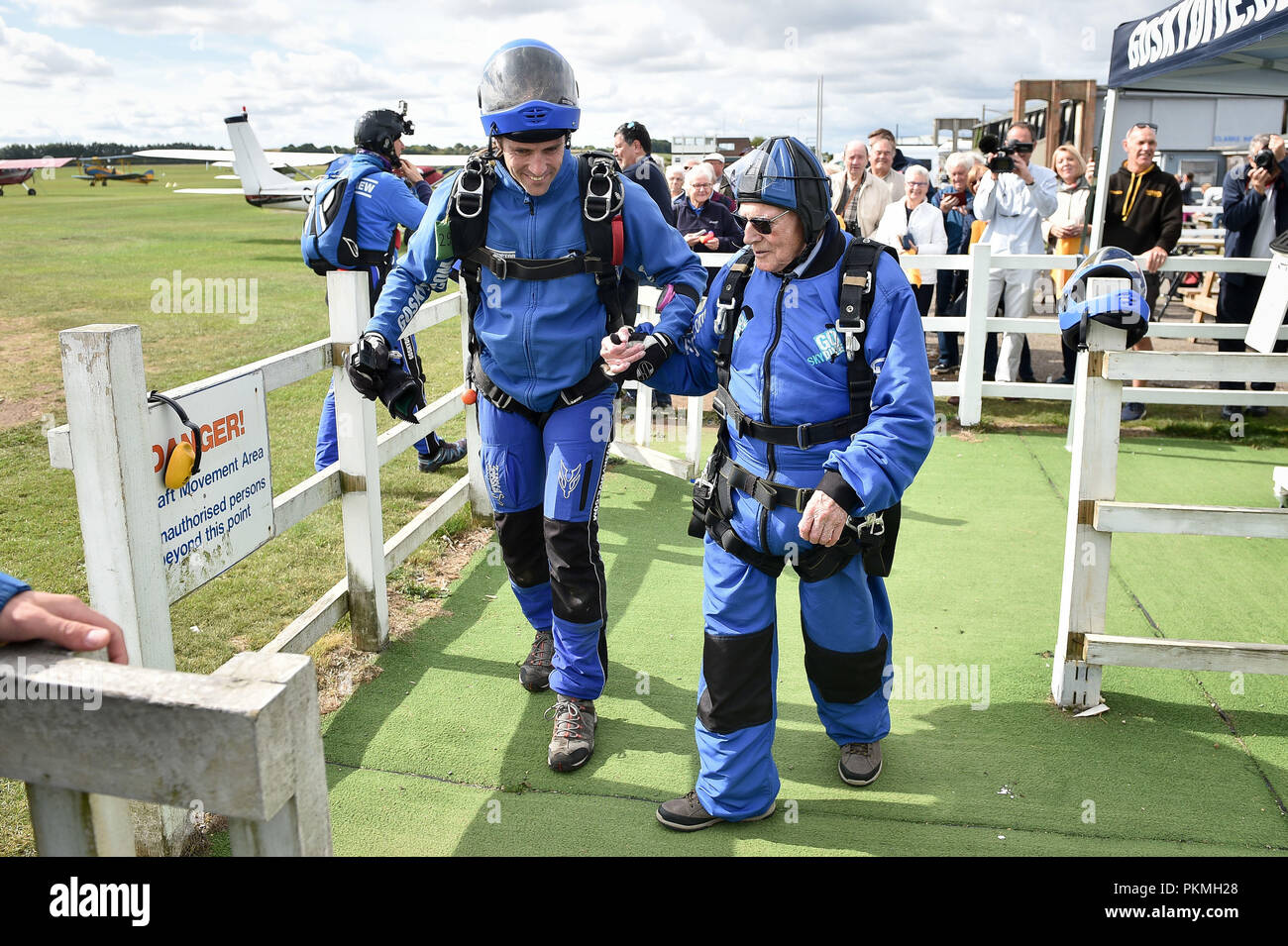 Harry Read, 94, is led to the aircraft by chief instructor Ryan Mancey ...