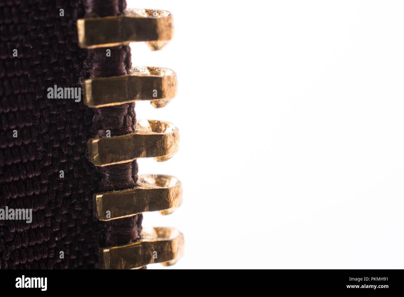 Close up or macro of a brown zipper on white background Stock Photo - Alamy
