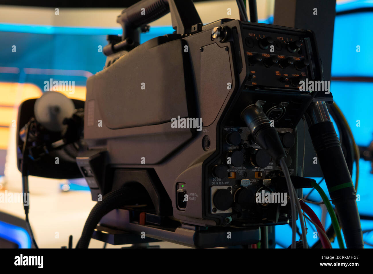 Television studio with camera and lights - camera on a crane. Shallow ...