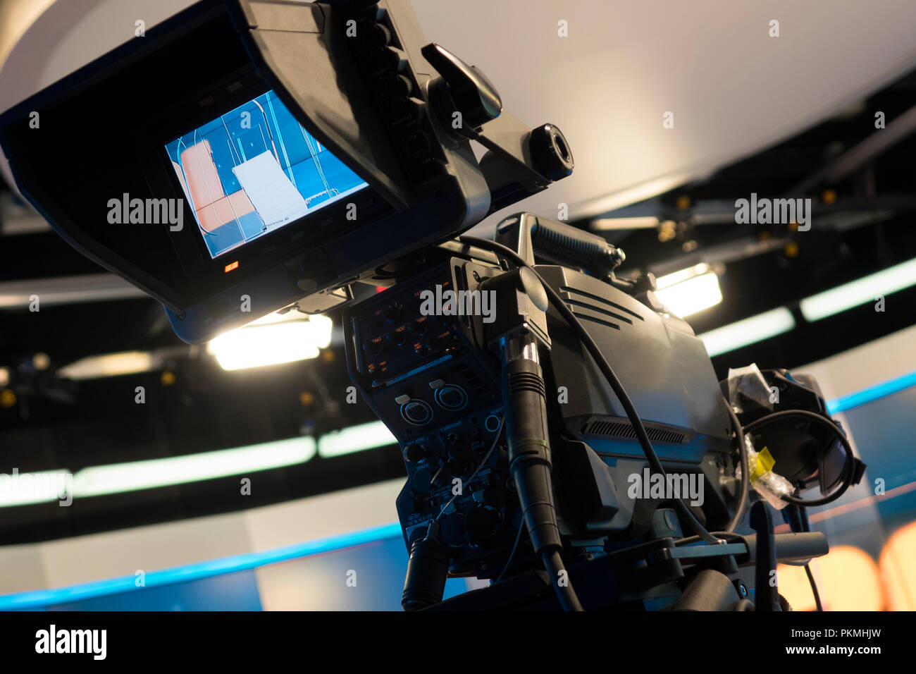 Television studio with camera and lights - recording TV show. Shallow ...
