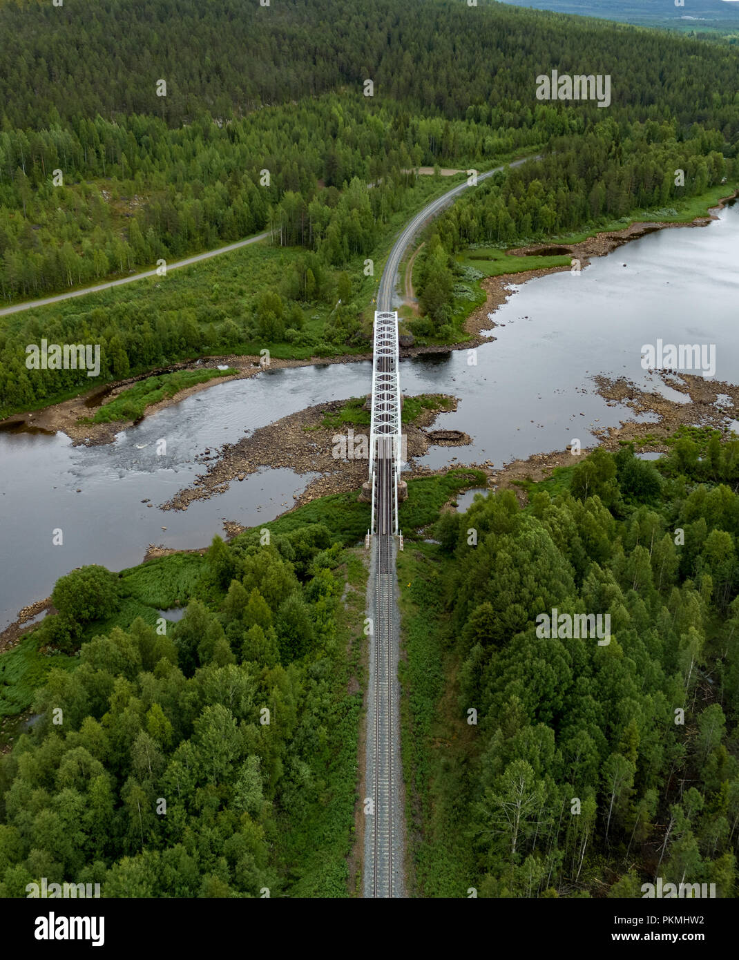 Steel railroad bridge over river in northern Finland seen from the sky ...