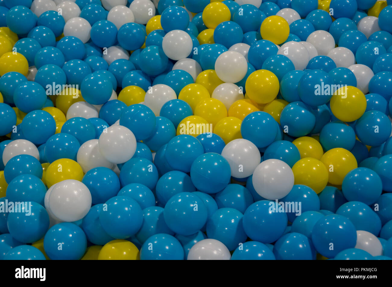 background with colorful plastic balls, red and yellow middle blue ...