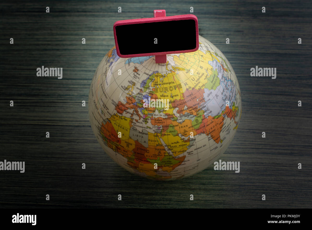 Mini size notice board made of wood on globe Stock Photo - Alamy