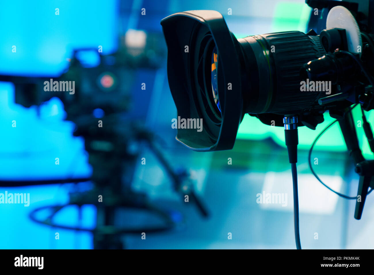 Broadcast television studio camera and crane camera in news studio room ...