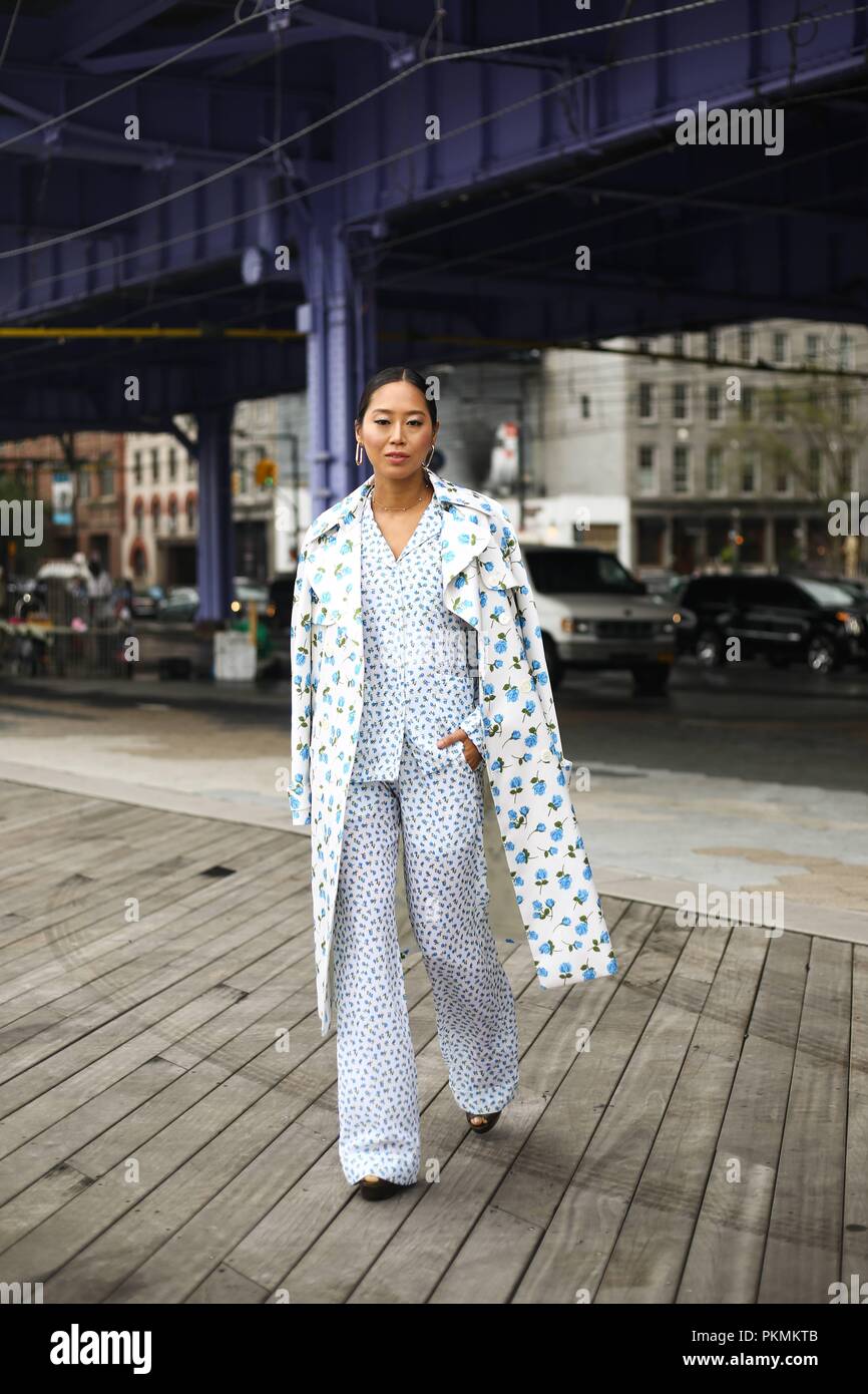 Blogger Aimee Song posing on the street outside of the Michael Kors ...