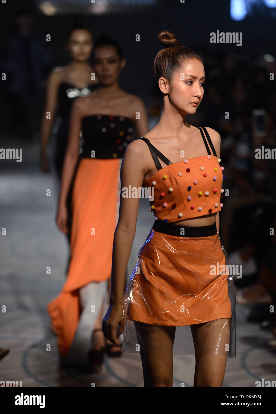 Vientiane, Laos. 14th Sep, 2018. A model presents a creation during the ...