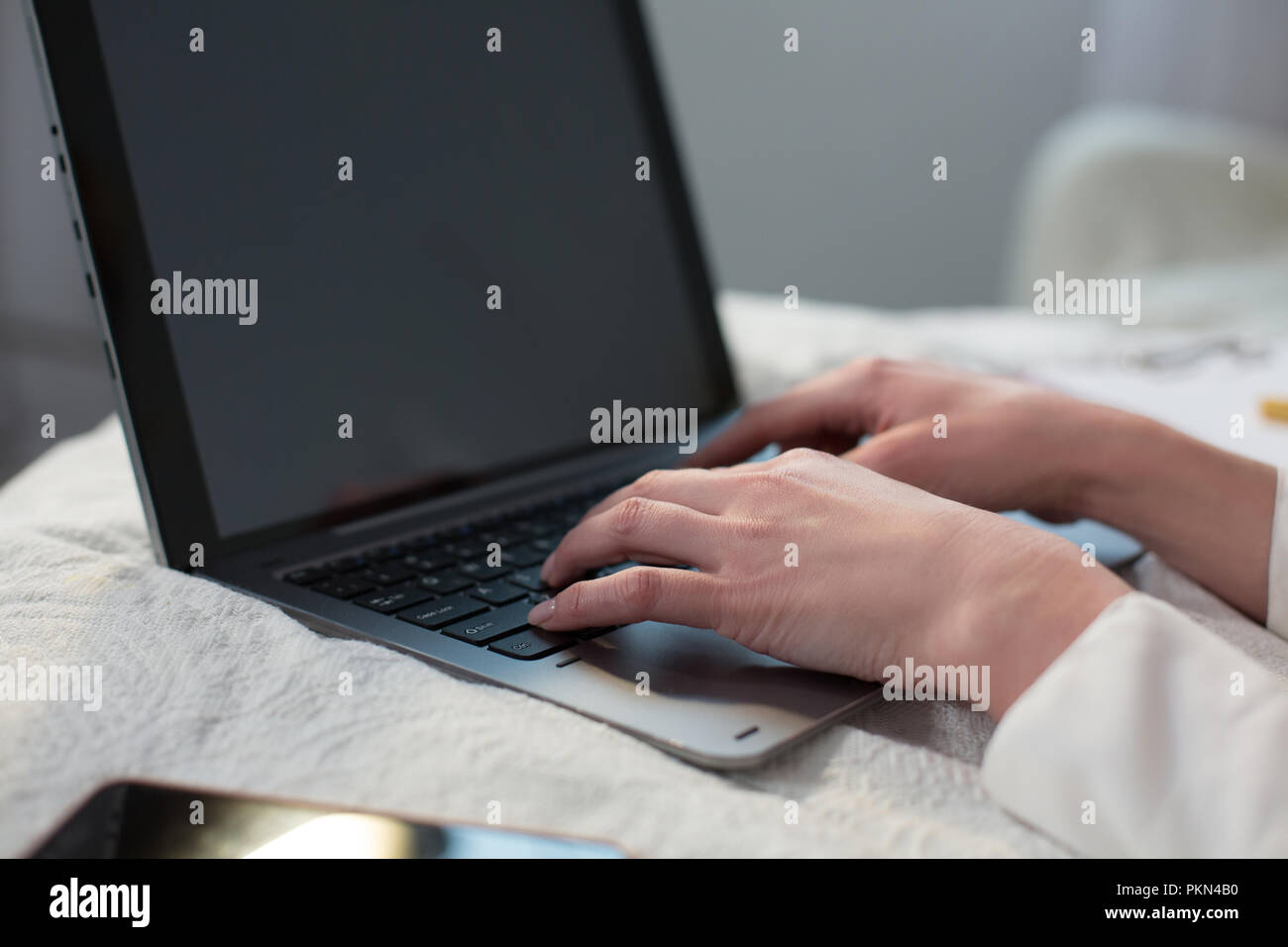 Businesswoman working laptop in bed Stock Photo - Alamy