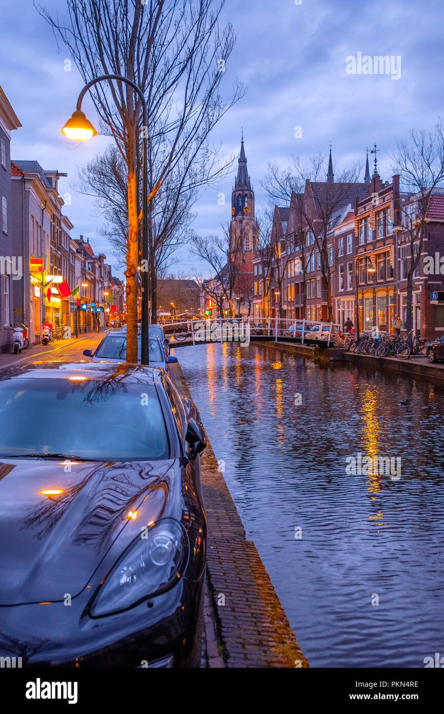 Evening view of the canal and the church in Delft. Dutch city in the ...
