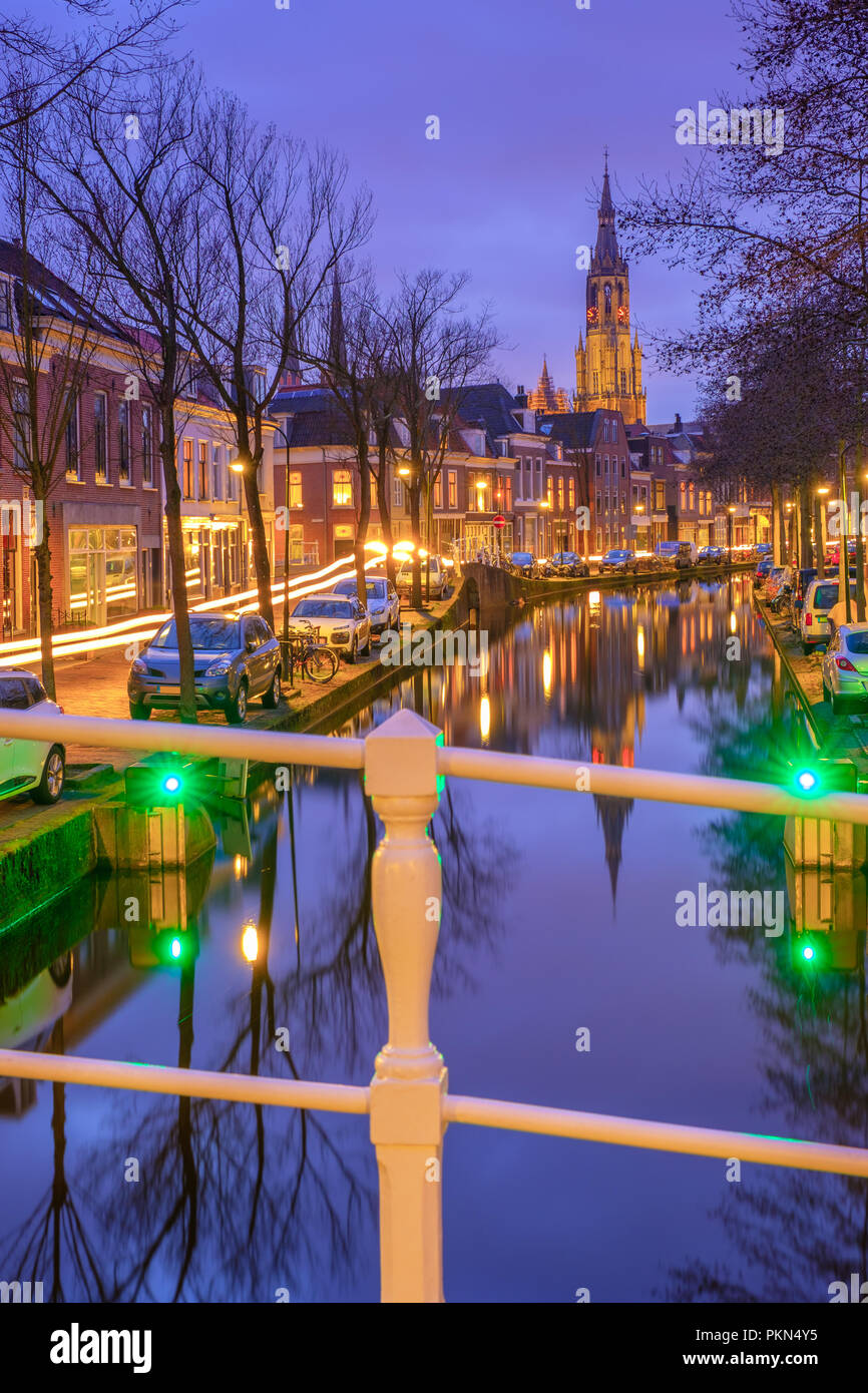 Evening view of the canal and the church in Delft. Dutch city in the ...