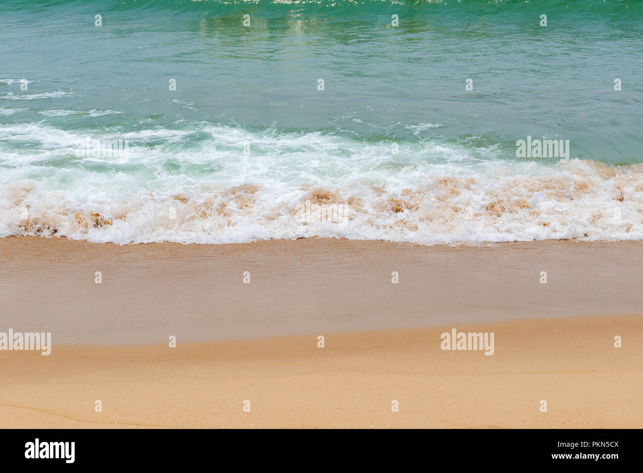 soft wave of an ocean on a sandy beach Stock Photo - Alamy
