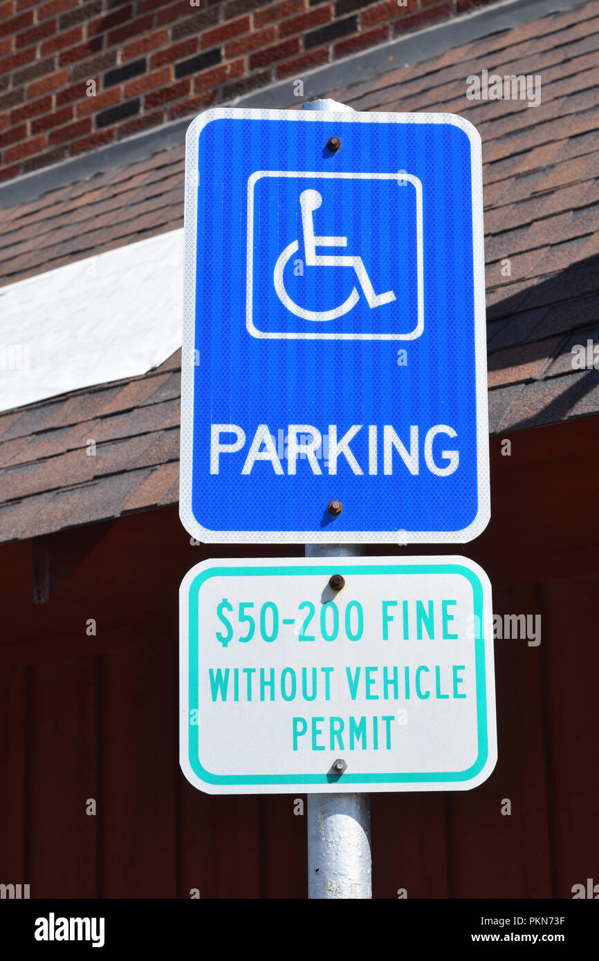 wheelchair graphic on parking sign Stock Photo - Alamy
