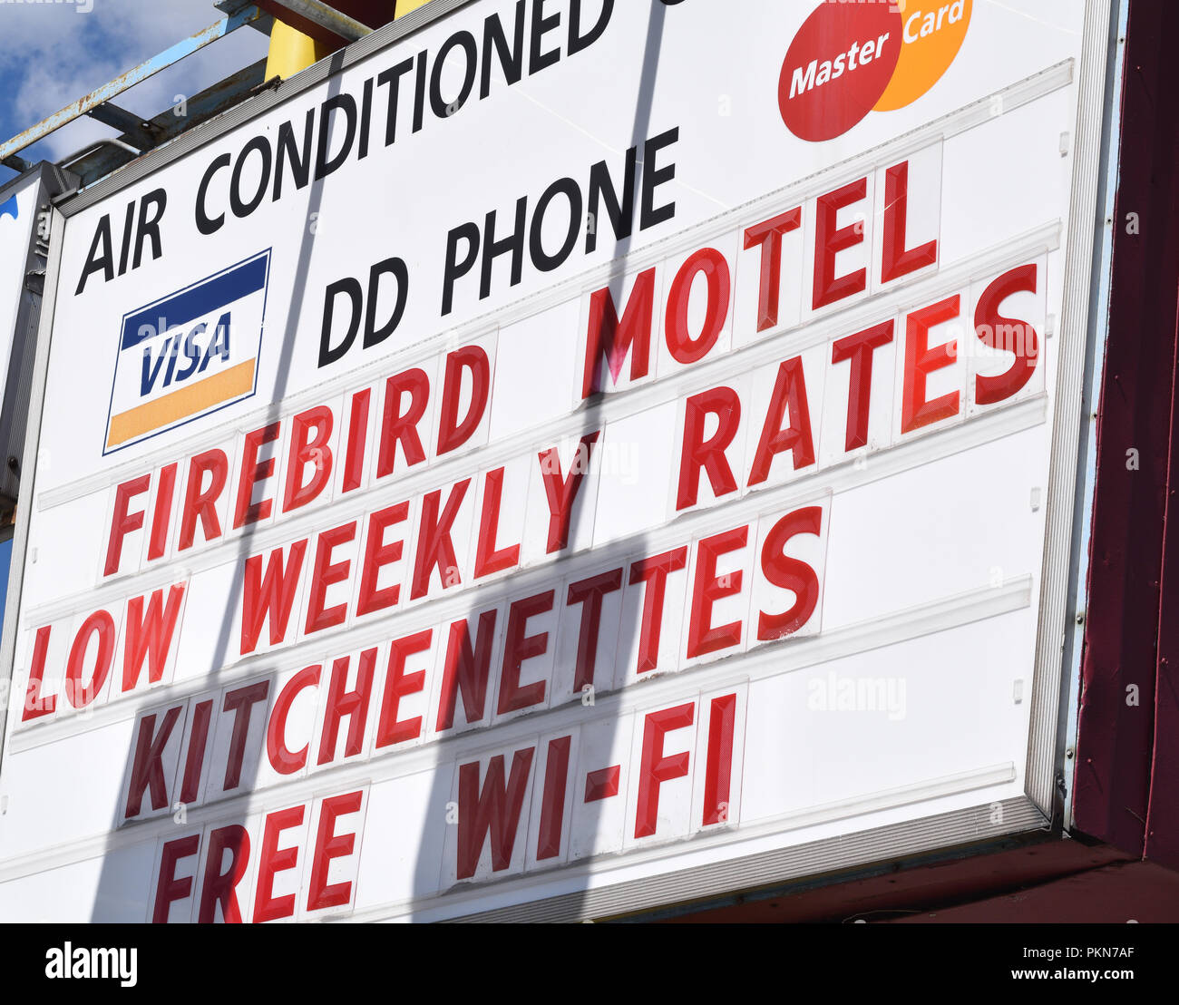 Old motel sign advertising their rooms are air conditioned and have a ...