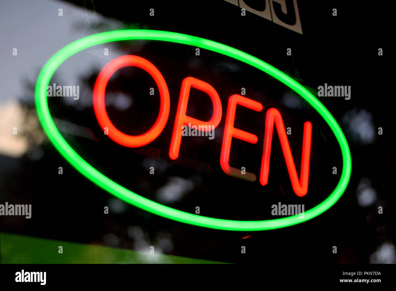 Neon open sign in a business window Stock Photo - Alamy
