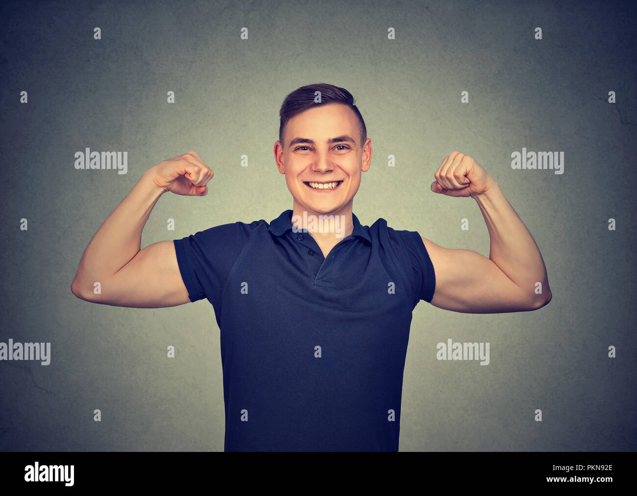 Male bodybuilder flexing his biceps hi-res stock photography and images ...