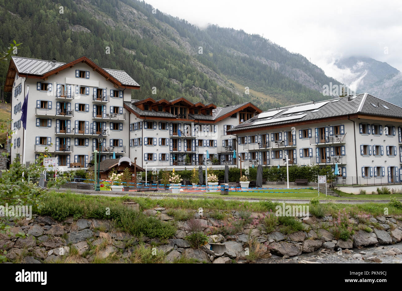 Typical Swiss architectural landscape with the mountains behind Stock ...