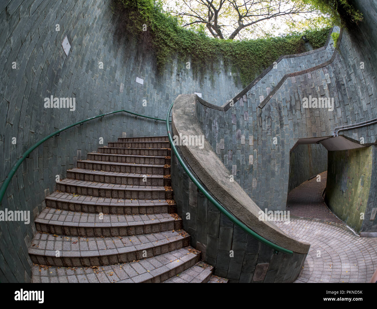 Spiral staircase of underground crossing in tunnel at Fort Canning Park ...