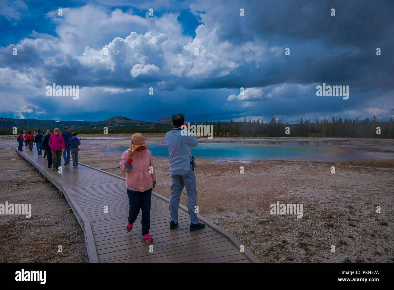 YELLOWSTONE, MONTANA, USA MAY 24, 2018: Crowd of tourists take pictures ...