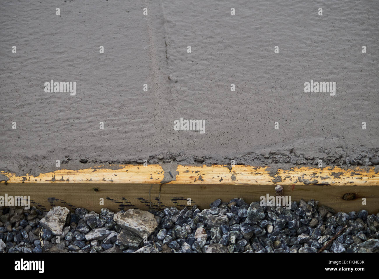 Fresh poured, leveled concrete and wood concrete shutter at concrete ...
