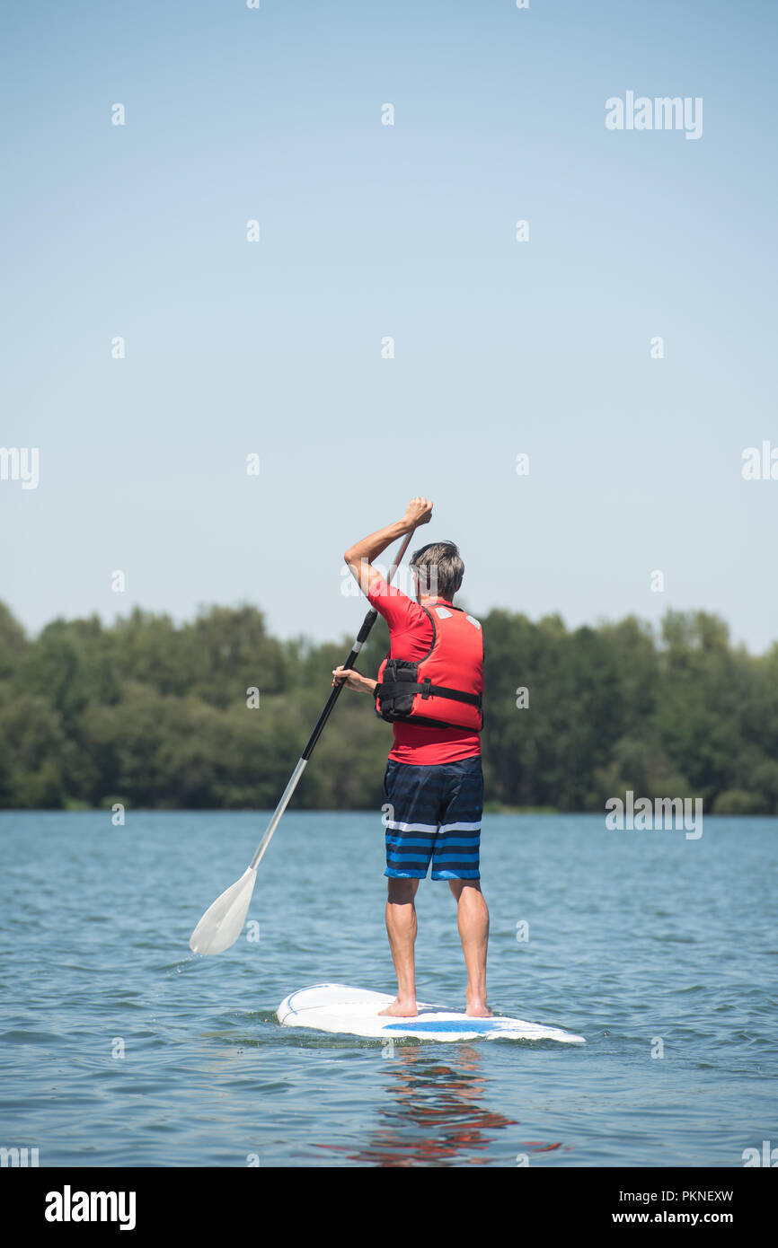 Boy on a paddleboard hi-res stock photography and images - Alamy