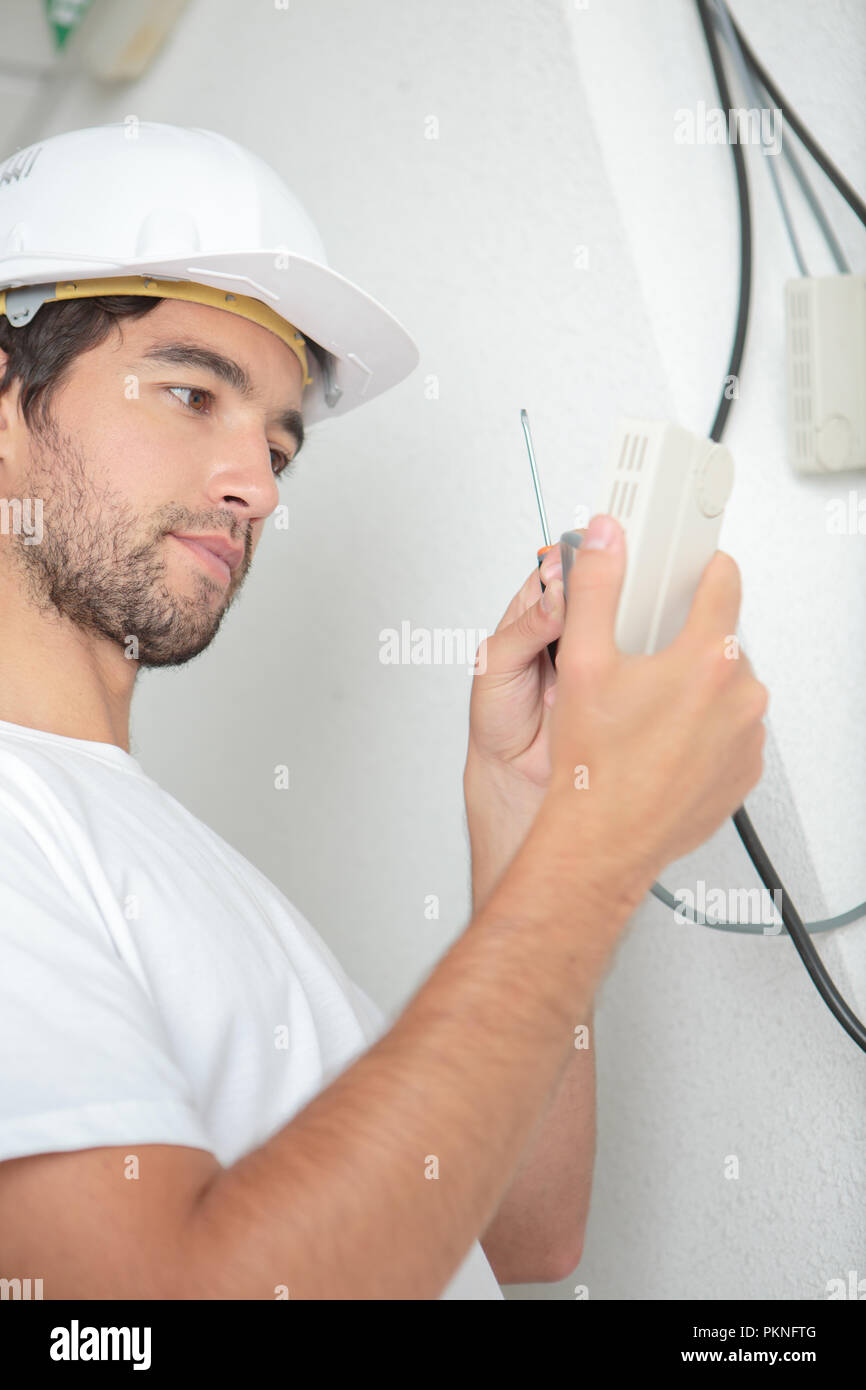 Man wiring switch Stock Photo - Alamy