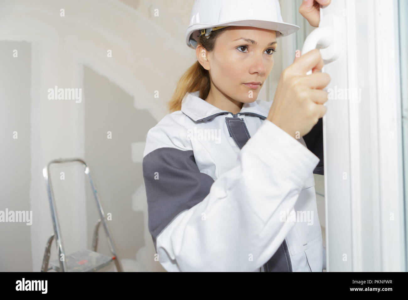 woman fitting windows Stock Photo - Alamy