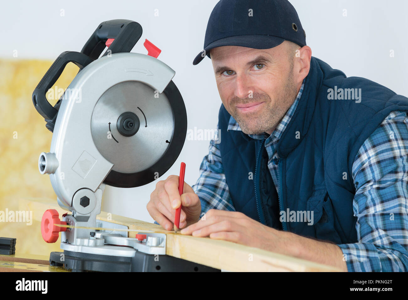 handsome carpenter looking at camera Stock Photo - Alamy