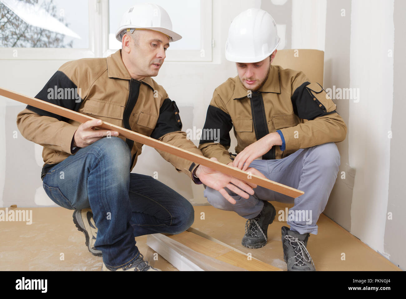 Man choosing wooden flooring hi-res stock photography and images - Alamy