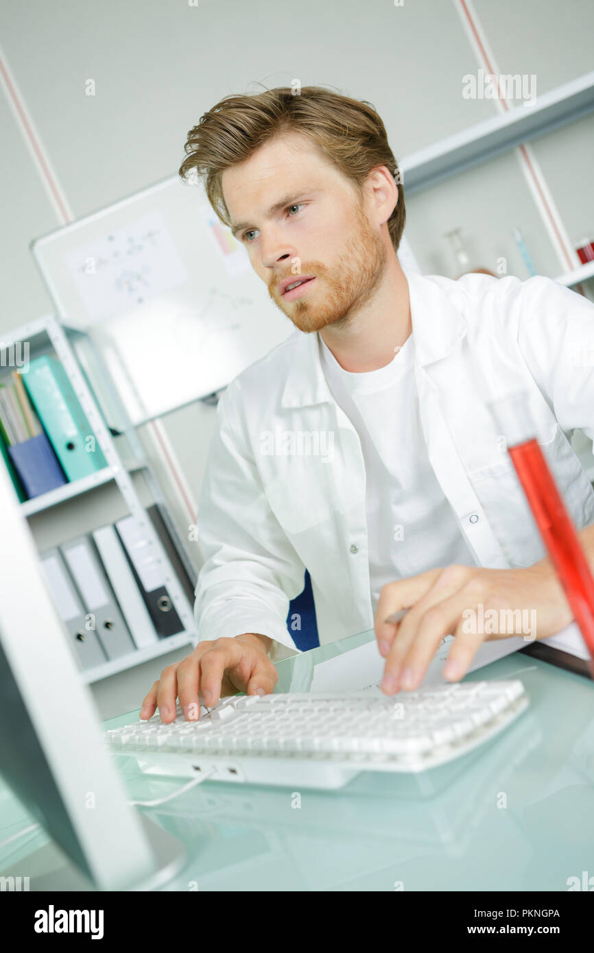 Medicine worker typing computer close hi-res stock photography and ...