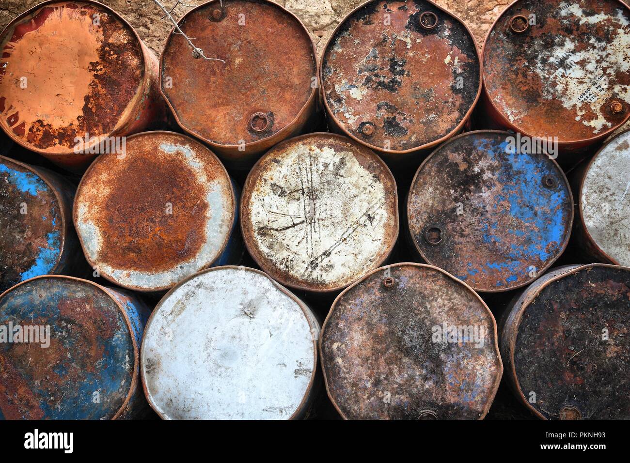Old rusty oil barrels. Industrial atmosphere background Stock Photo - Alamy
